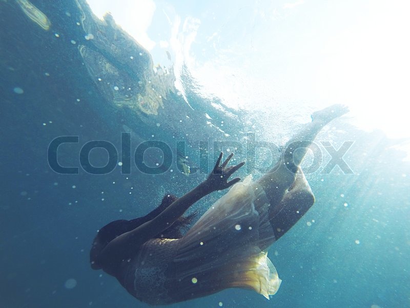 Underwater photo of a human diving in ... | Stock image | Colourbox