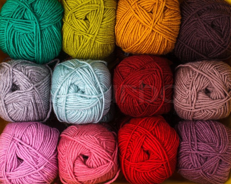 Various colors threads on rows in the ... | Stock image | Colourbox