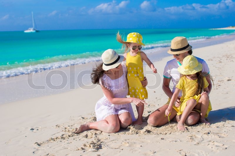 Happy beautiful family posing at beach ... | Stock image | Colourbox