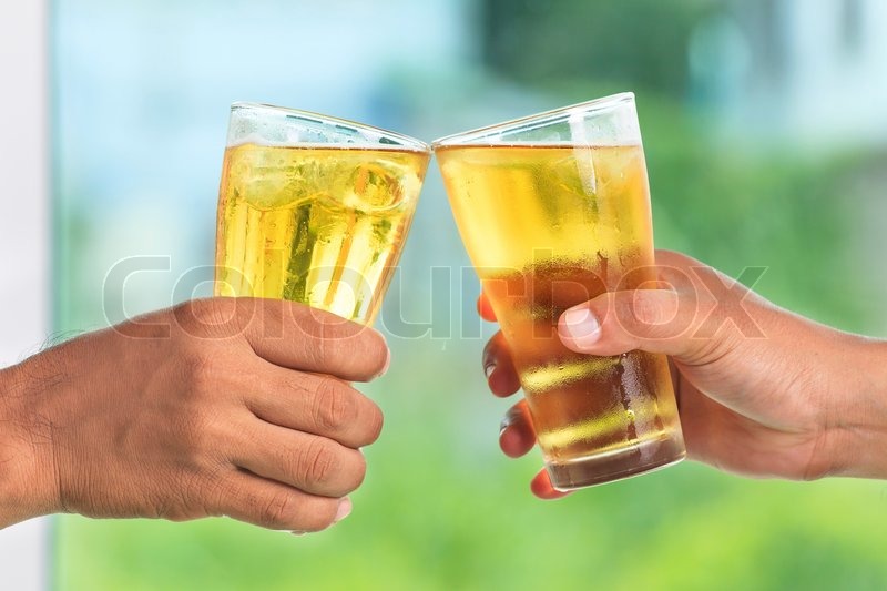 Friends clinking with beer glass | Stock image | Colourbox