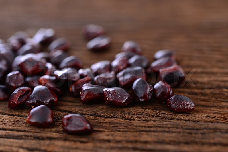 Tamarind seed on old wood table | Stock image | Colourbox