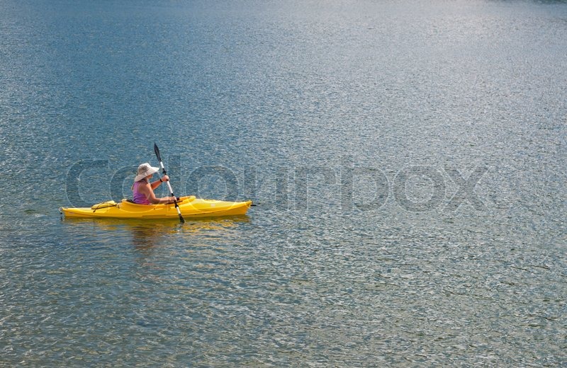 Woman Kayaking on Beautiful Peaceful ... | Stock image | Colourbox