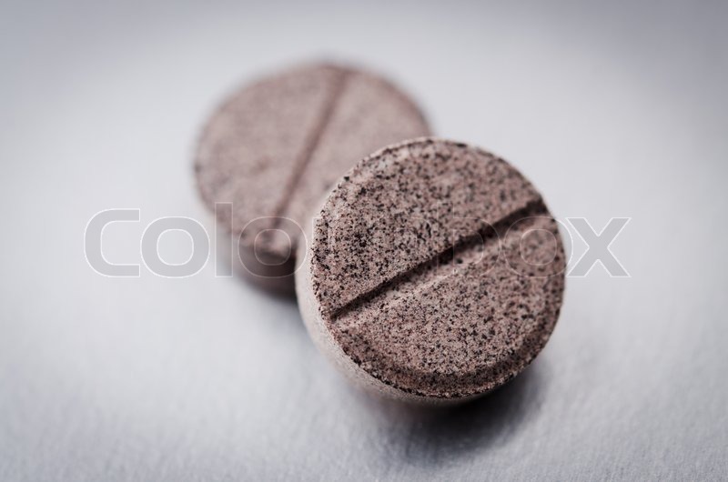 Close up of two pills | Stock image | Colourbox