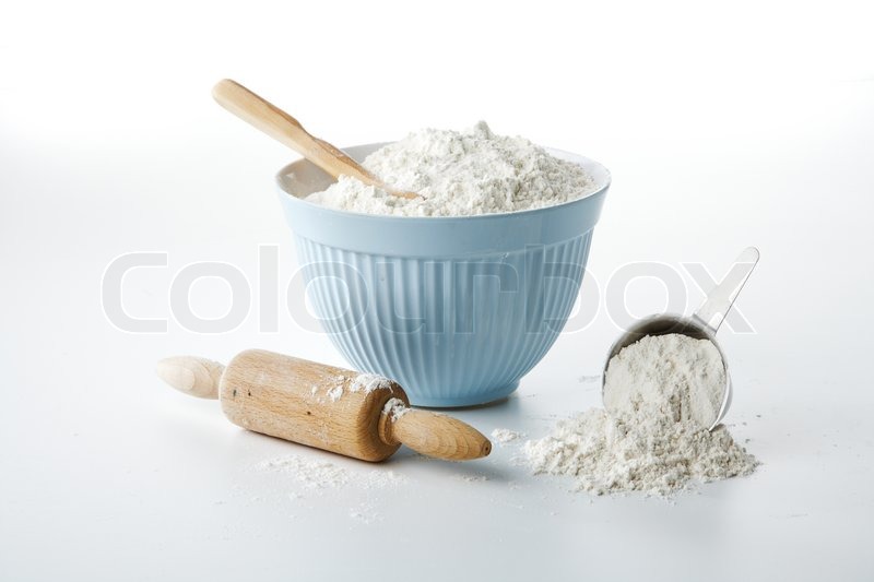 Flour in a bowl with wooden spoon, ... | Stock Photo | Colourbox