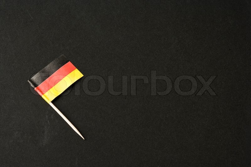 Miniature German flag on a toothpick | Stock image | Colourbox