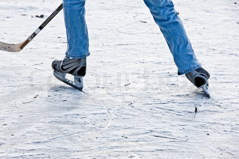Ice skating in frozen lake | Stock image | Colourbox