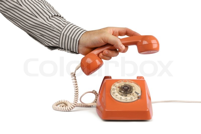 Male hand lifting vintage telephone ... | Stock image | Colourbox