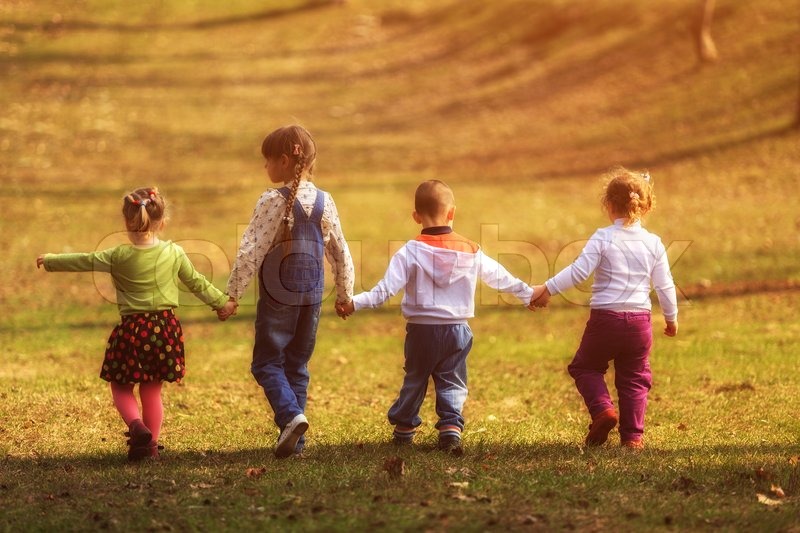 Children playing in the park together | Stock image | Colourbox