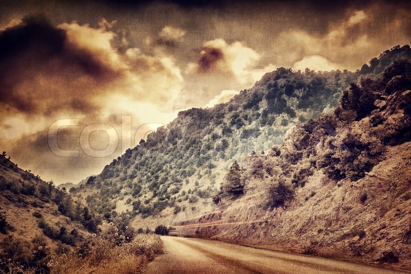 Grunge style photo of road passing ... | Stock image | Colourbox