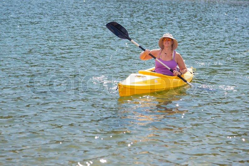 Woman Kayaking on Beautiful Peaceful ... | Stock image | Colourbox