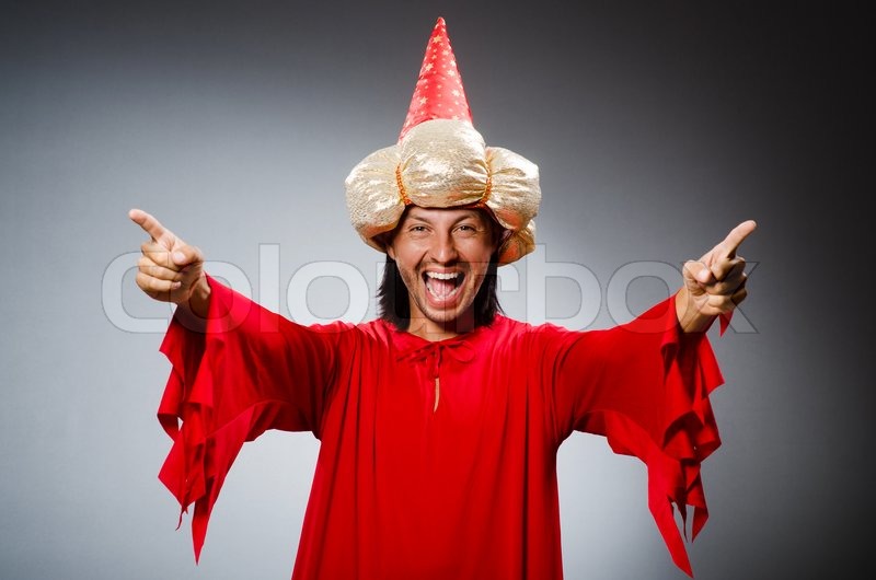 Funny wizard wearing red dress | Stock image | Colourbox