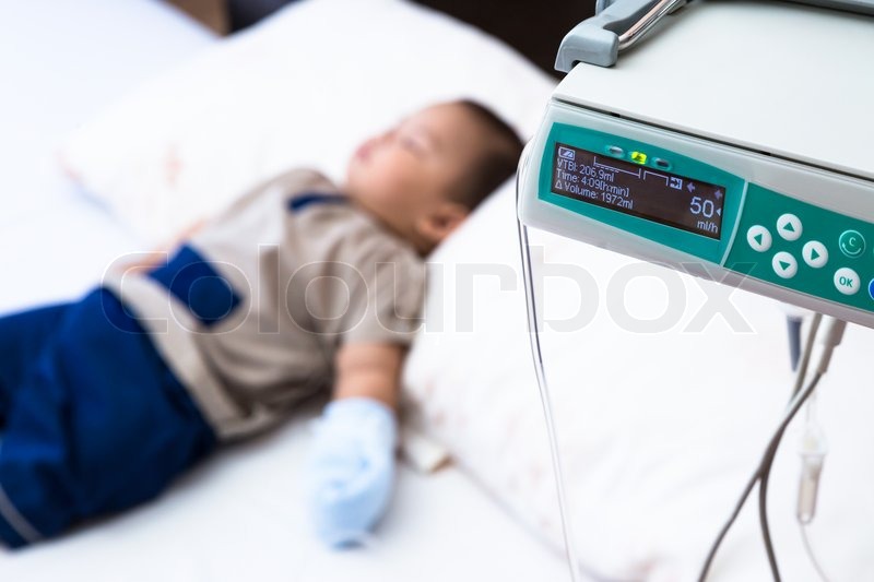 Sick baby receiving intravenous therapy ... | Stock image | Colourbox