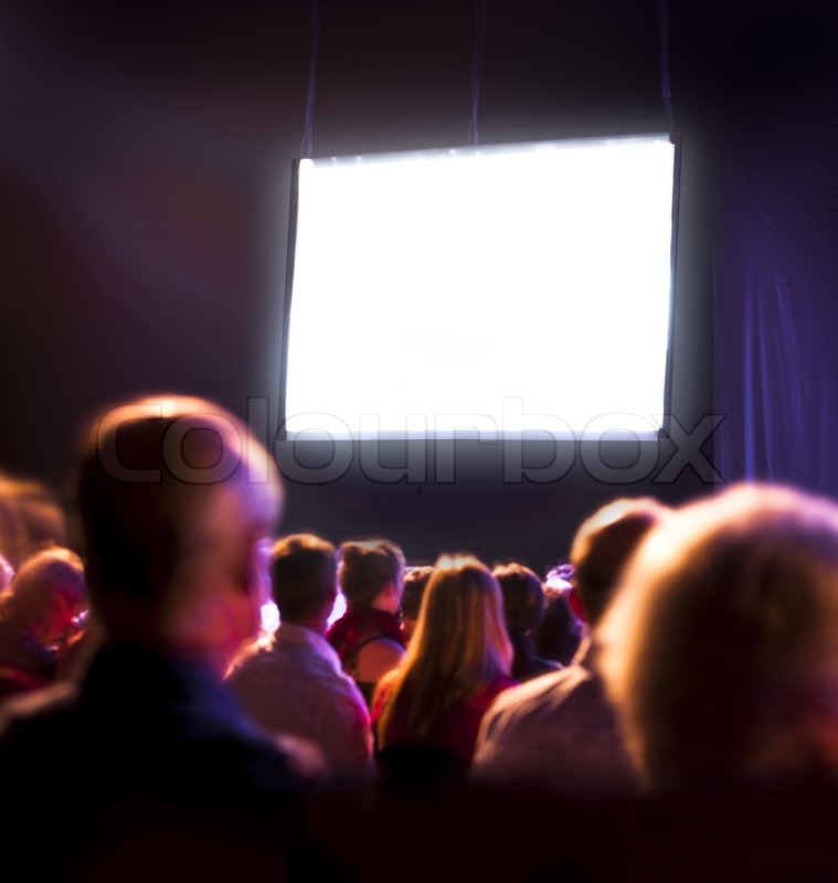 Crowd audience in dark looking at ... | Stock image | Colourbox