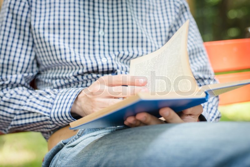 Book in hand closeup | Stock image | Colourbox