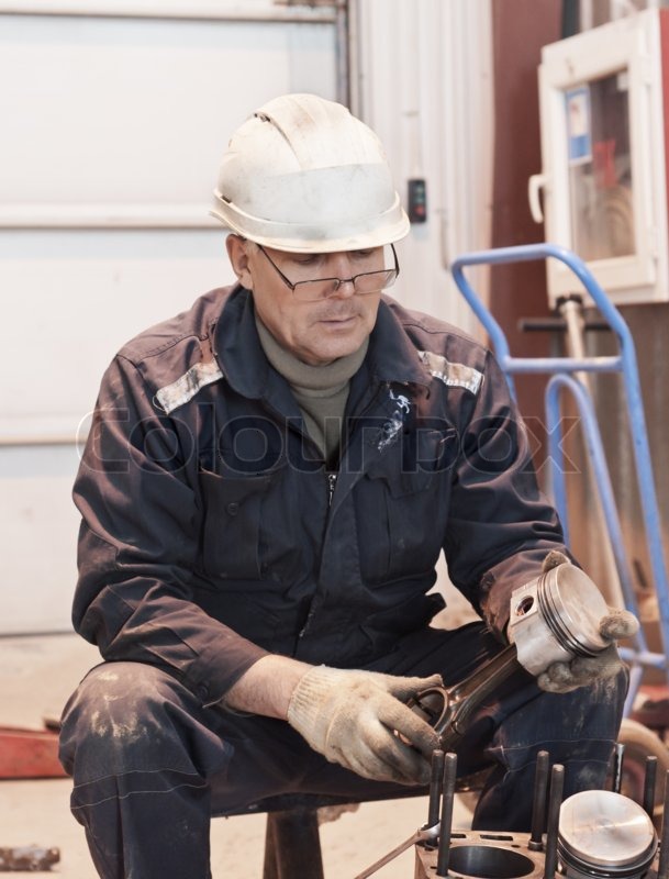Industrial platform. The mechanic does ... | Stock image | Colourbox