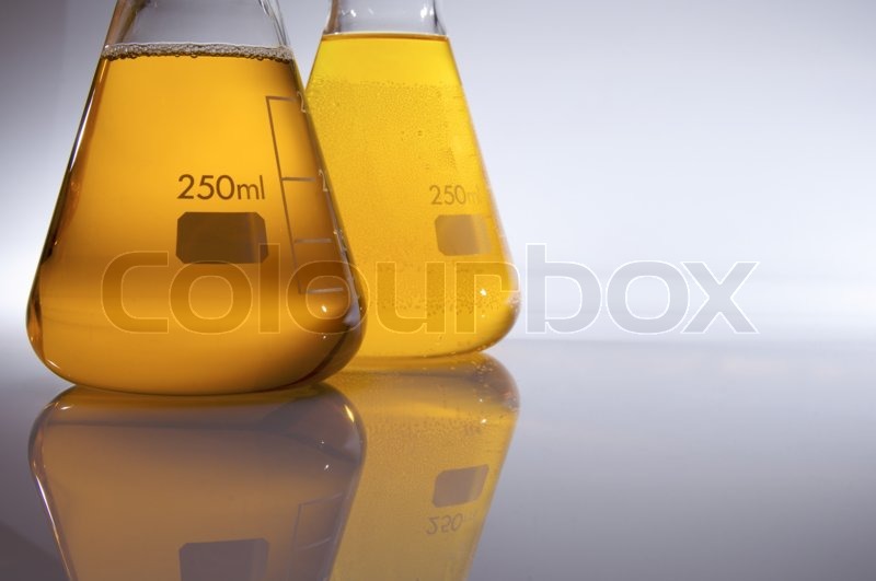 Two flasks with orange liquid | Stock image | Colourbox