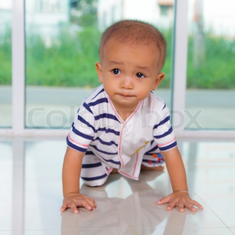 Portrait of a baby in the house | Stock image | Colourbox