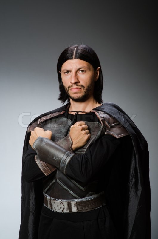 Angry warrior against dark background | Stock image | Colourbox