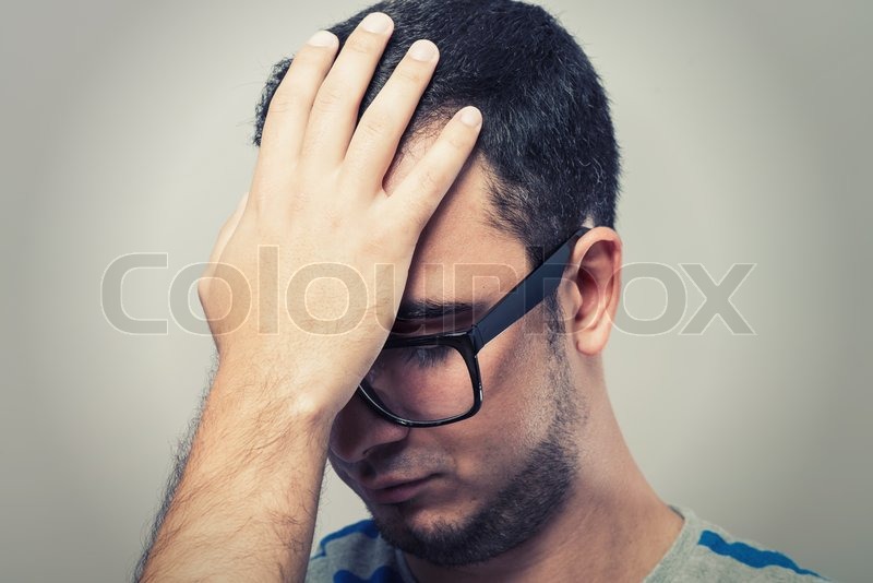 Standing young tired man yawning and ... | Stock image | Colourbox