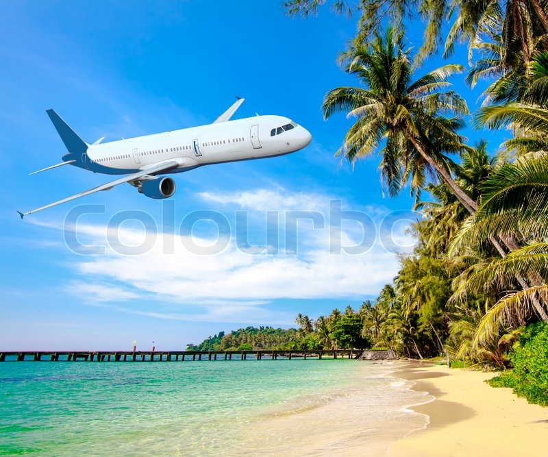 Jet plane over the tropical sea | Stock image | Colourbox
