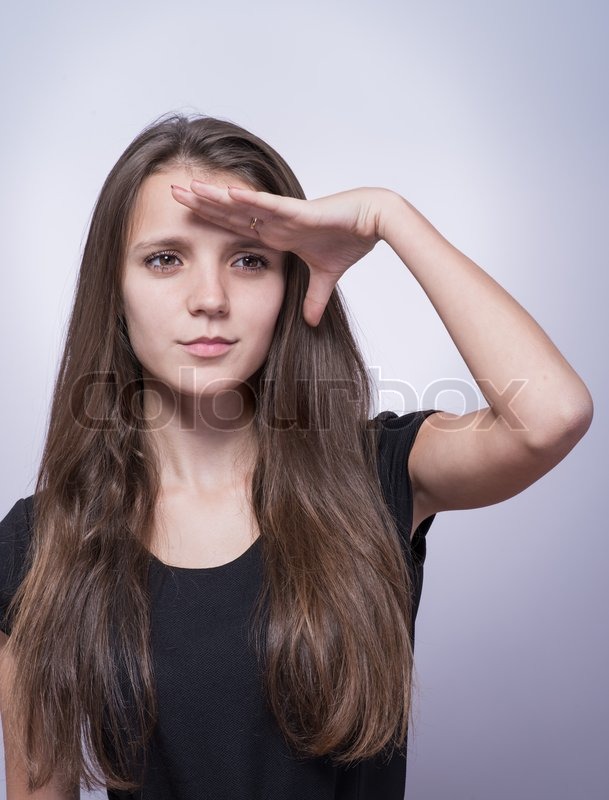 Woman with hand on forehead looking ... | Stock image | Colourbox