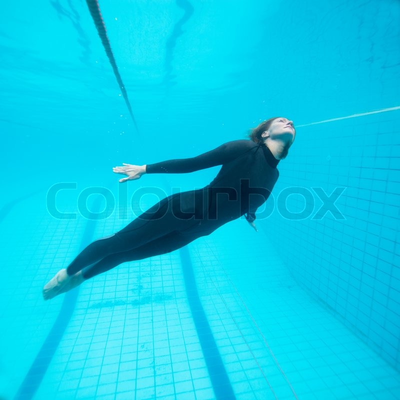 Female diver appearing to fly ... | Stock image | Colourbox