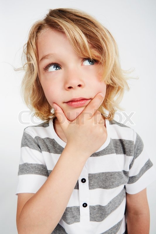 Boy looking up in studio, close up | Stock image | Colourbox