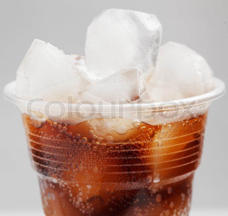 Ice cubes in a plastic cup with a drink ... | Stock image | Colourbox