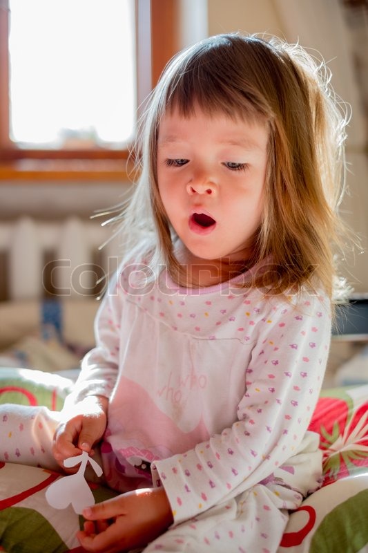 Cute little girl yawning | Stock image | Colourbox