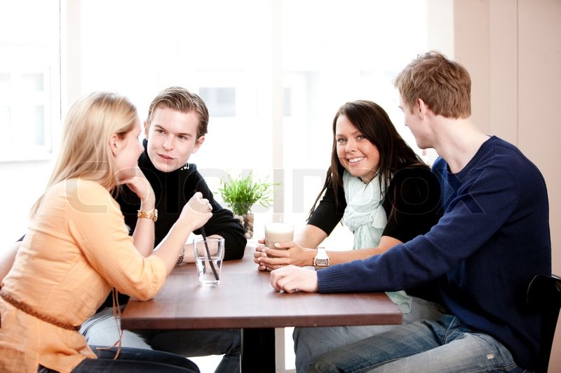 Two young caucasian couples on a double date in a restaurant | Stock ...