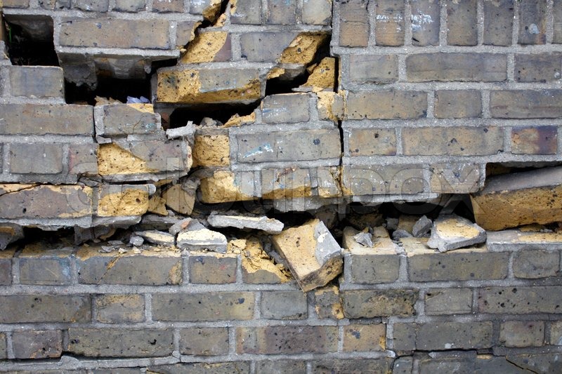 Destroyed brick wall | Stock image | Colourbox