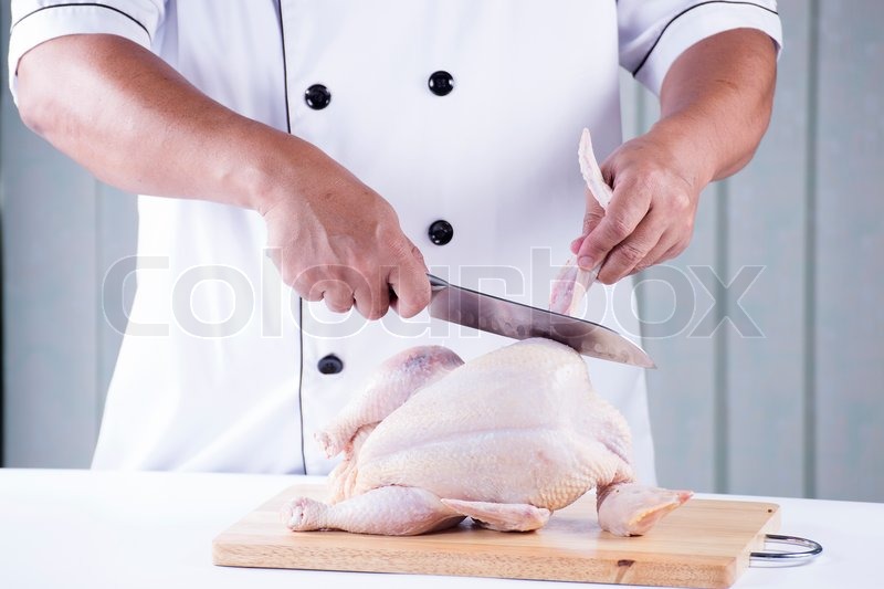 Chef prepared chopping raw chicken ... | Stock image | Colourbox