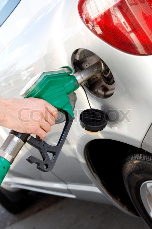 A man pumping gasoline into his car | Stock image | Colourbox