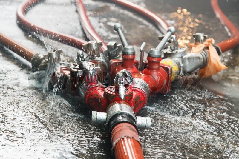 Fire Water hose connector on the ground | Stock image | Colourbox