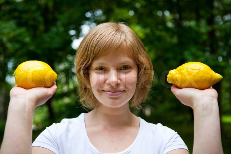 Girl holding lemons | Stock image | Colourbox