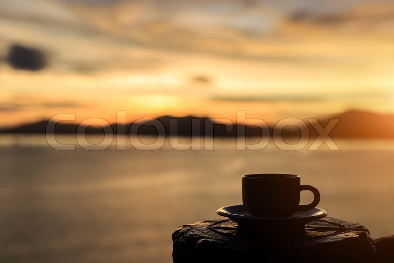 Coffee cup and sunset | Stock image | Colourbox