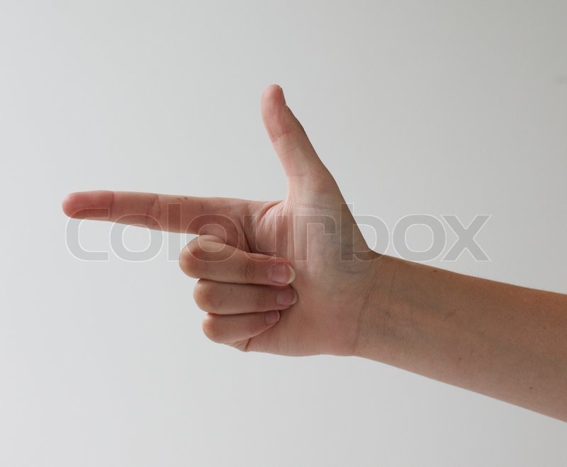 Hand gesturing sign language - firing a ... | Stock image | Colourbox
