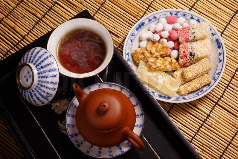 Chinese tea with traditional snack. | Stock image | Colourbox