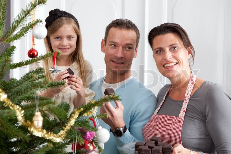 A happy family eating chocolate on ... | Stock image | Colourbox