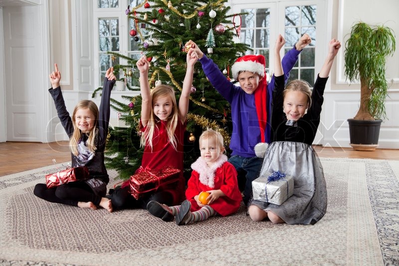 Caucasian children gathering around the ... | Stock image | Colourbox