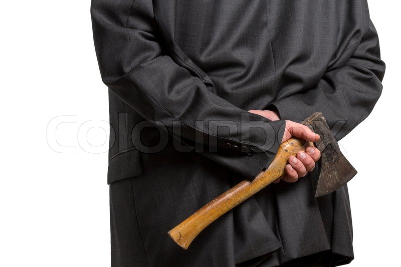 Man in suit hiding an axe behind his ... | Stock image | Colourbox