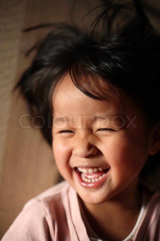 Close up of child head while laughing | Stock image | Colourbox