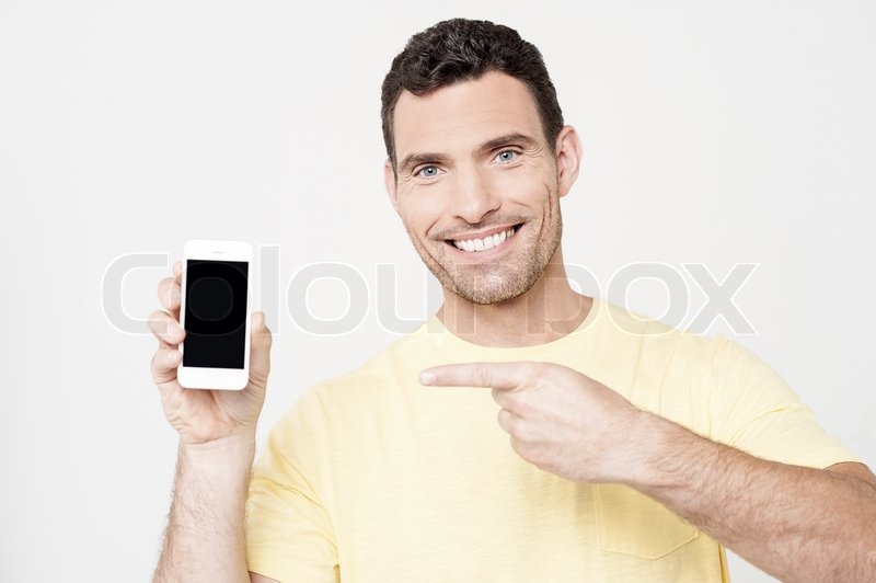 Young man showing of mobile phone with ... | Stock Photo | Colourbox