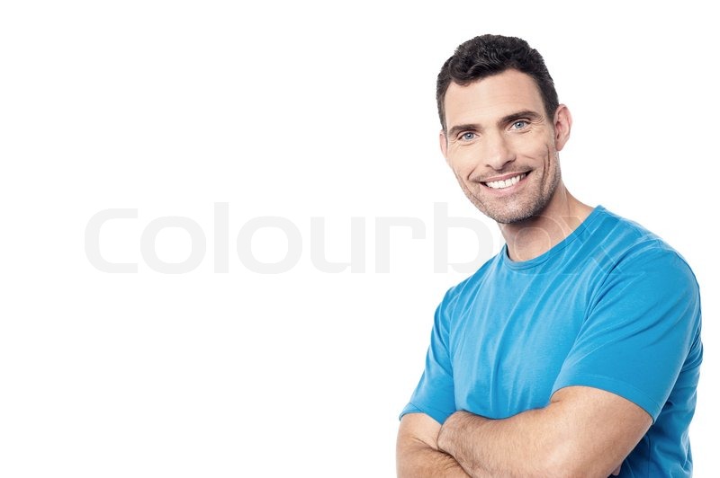 Casual young man standing with arms ... | Stock image | Colourbox