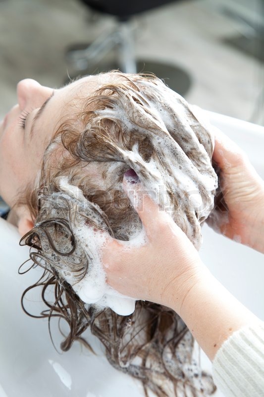 A woman getting her hair washed in a ... | Stock image | Colourbox