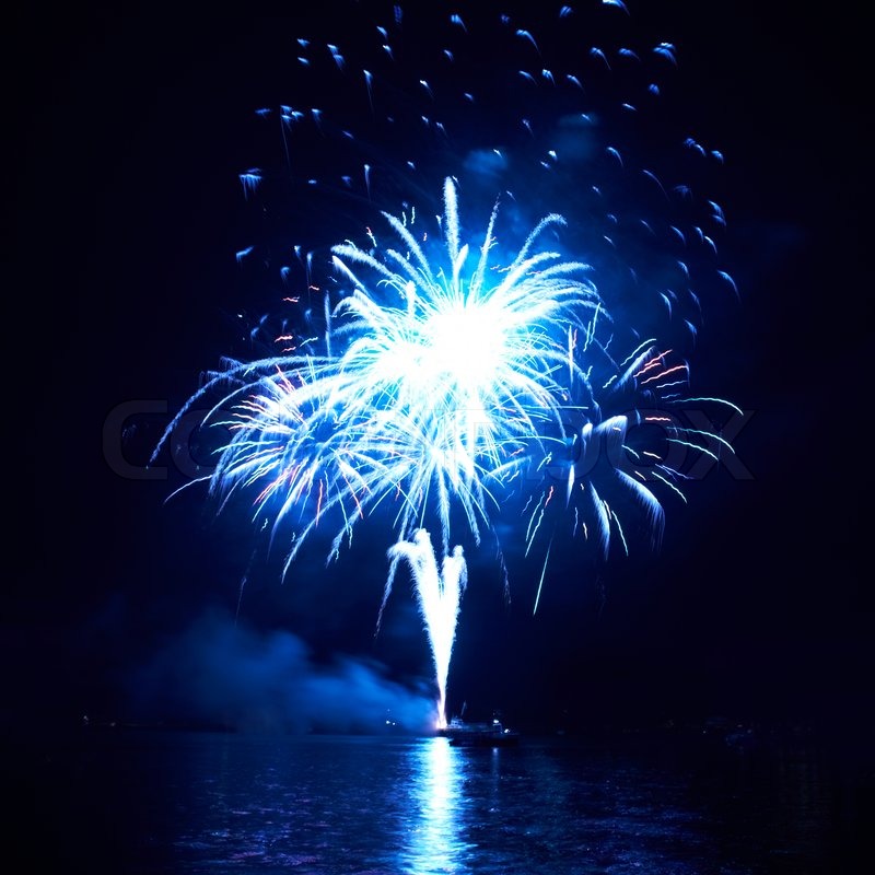 Blue colorful fireworks on the black ... | Stock image | Colourbox