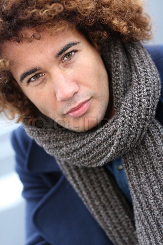 Handsome mixed-raced guy in city street | Stock image | Colourbox