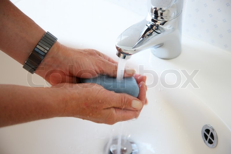 A woman washes herself in the bathroom ... | Stock image | Colourbox