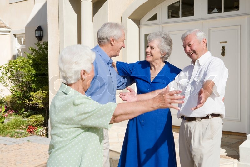 Senior couple greeting friends outside ... | Stock image | Colourbox