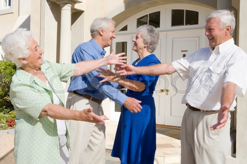Senior couple greeting friends outside ... | Stock image | Colourbox